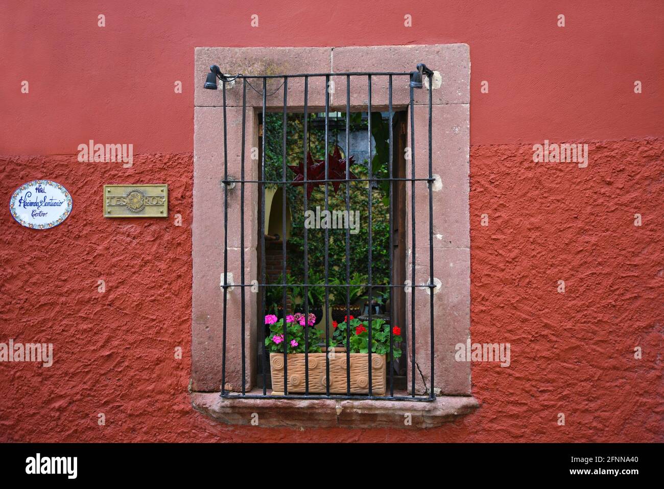 Antique Colonial house window with handcrafted iron grilles and clay ...