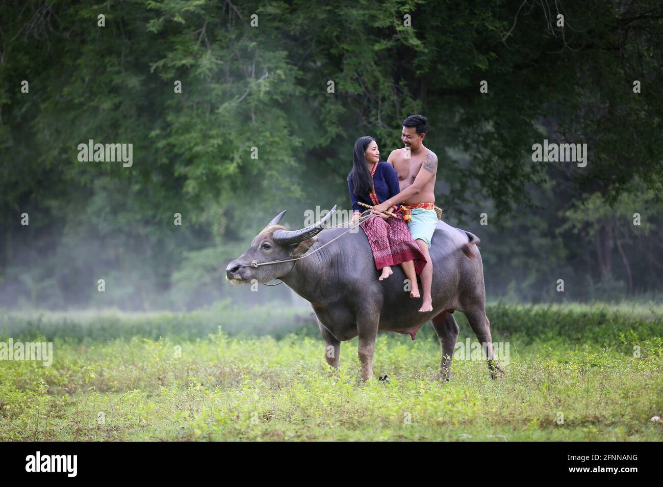 Riding on buffalo hi-res stock photography and images - Alamy