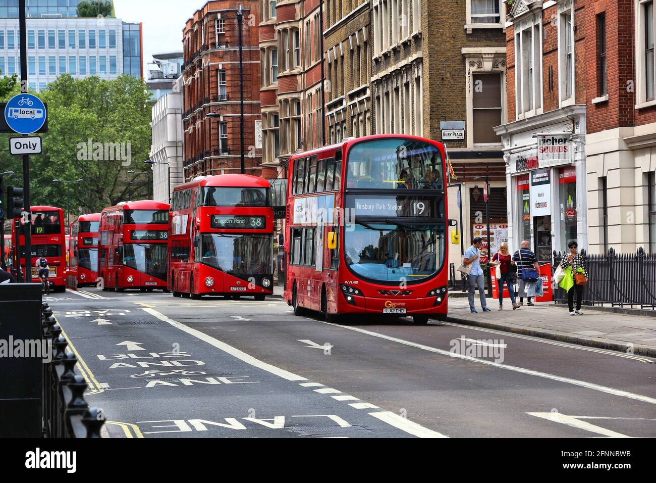 LONDON, UK - JULY 9, 2016: People ride a double decker buses at ...