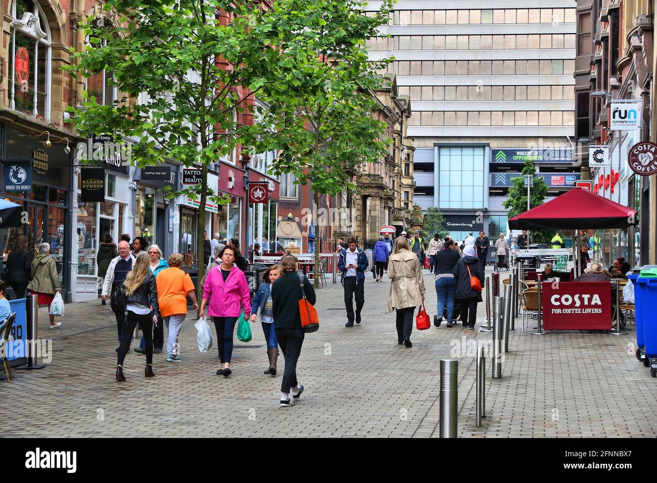 LEEDS, UK - JULY 11, 2016: People shop at Albion Place street in ...