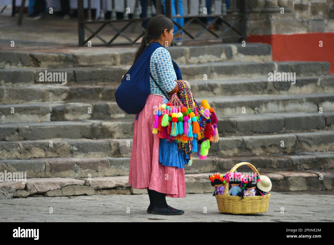 Indigenous woman selling authentic handmade rag dolls and souvenirs on ...
