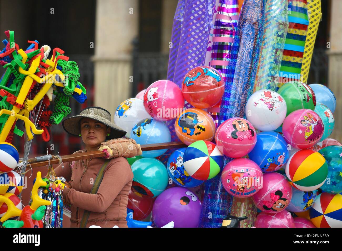 Colorful balloons vendor on the cobblestone streets of San Miguel de ...