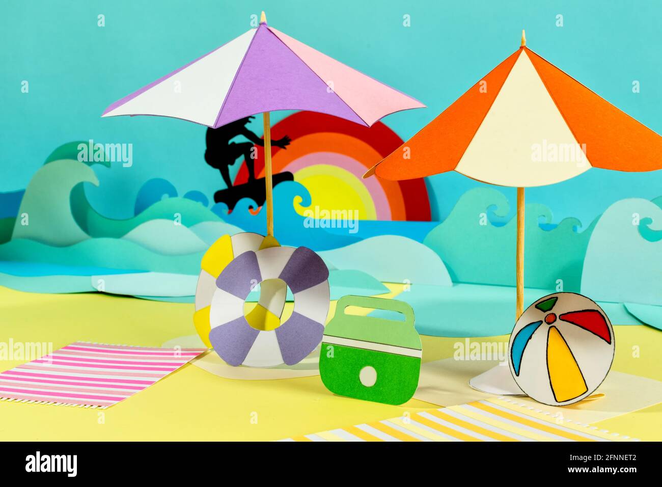 Creative paper craft of a surfer on the waves and a sandy beach Stock ...