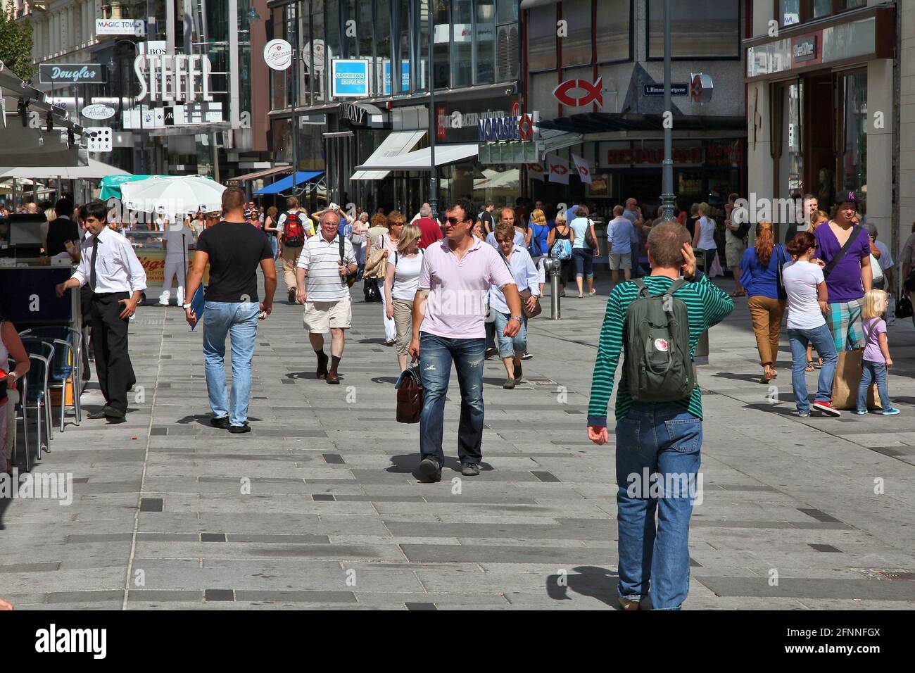 VIENNA, AUSTRIA - SEPTEMBER 5, 2011: People stroll in Karntner Strasse ...