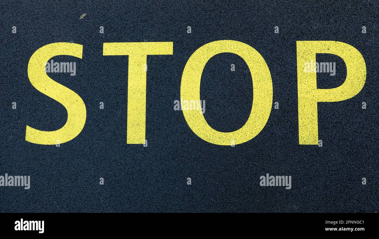STOP written on the ground Stock Photo - Alamy