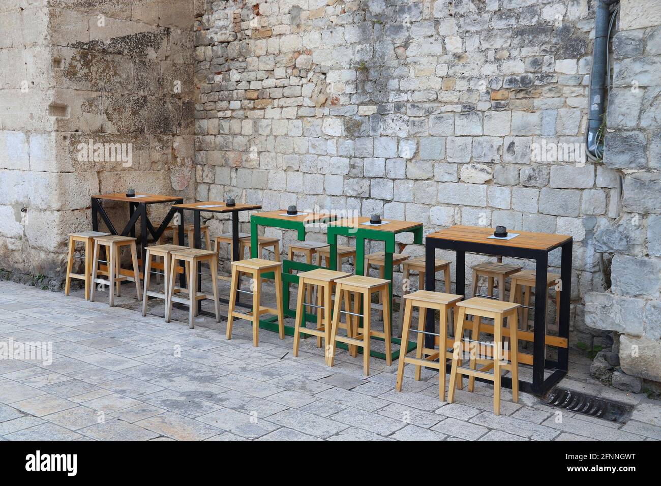 Sidewalk cafe tables in Split, Croatia. Restaurant by the city walls of ...