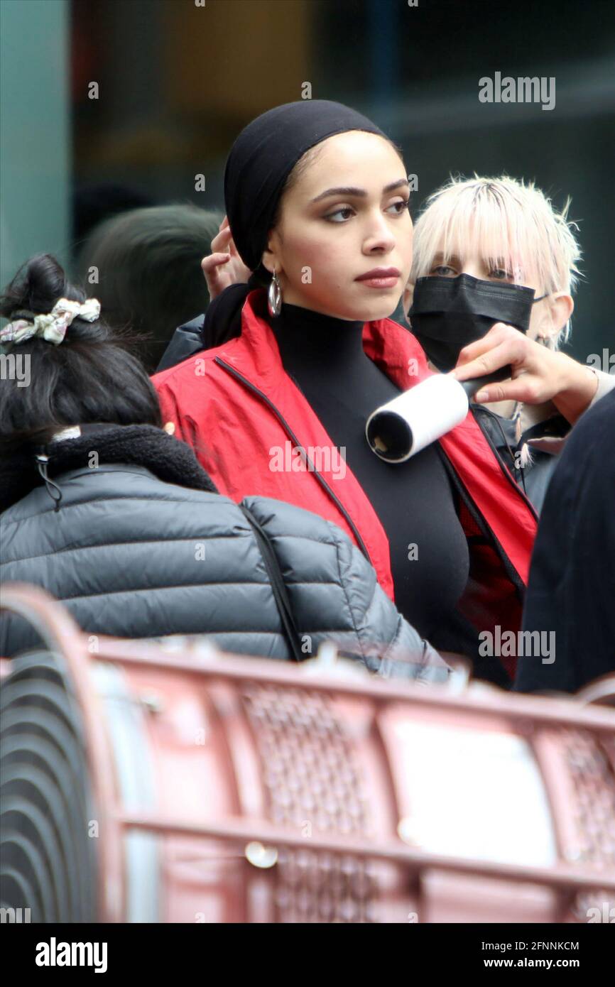 New York - NY - 20210427 Nura Afia holds an umbrella on set of filming a Maybelline commercial ...
