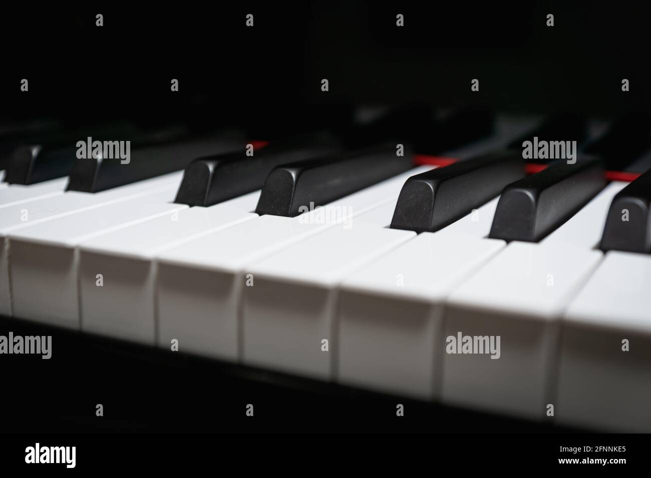 Piano keys on classical grand piano - closeup of piano keyboard for ...