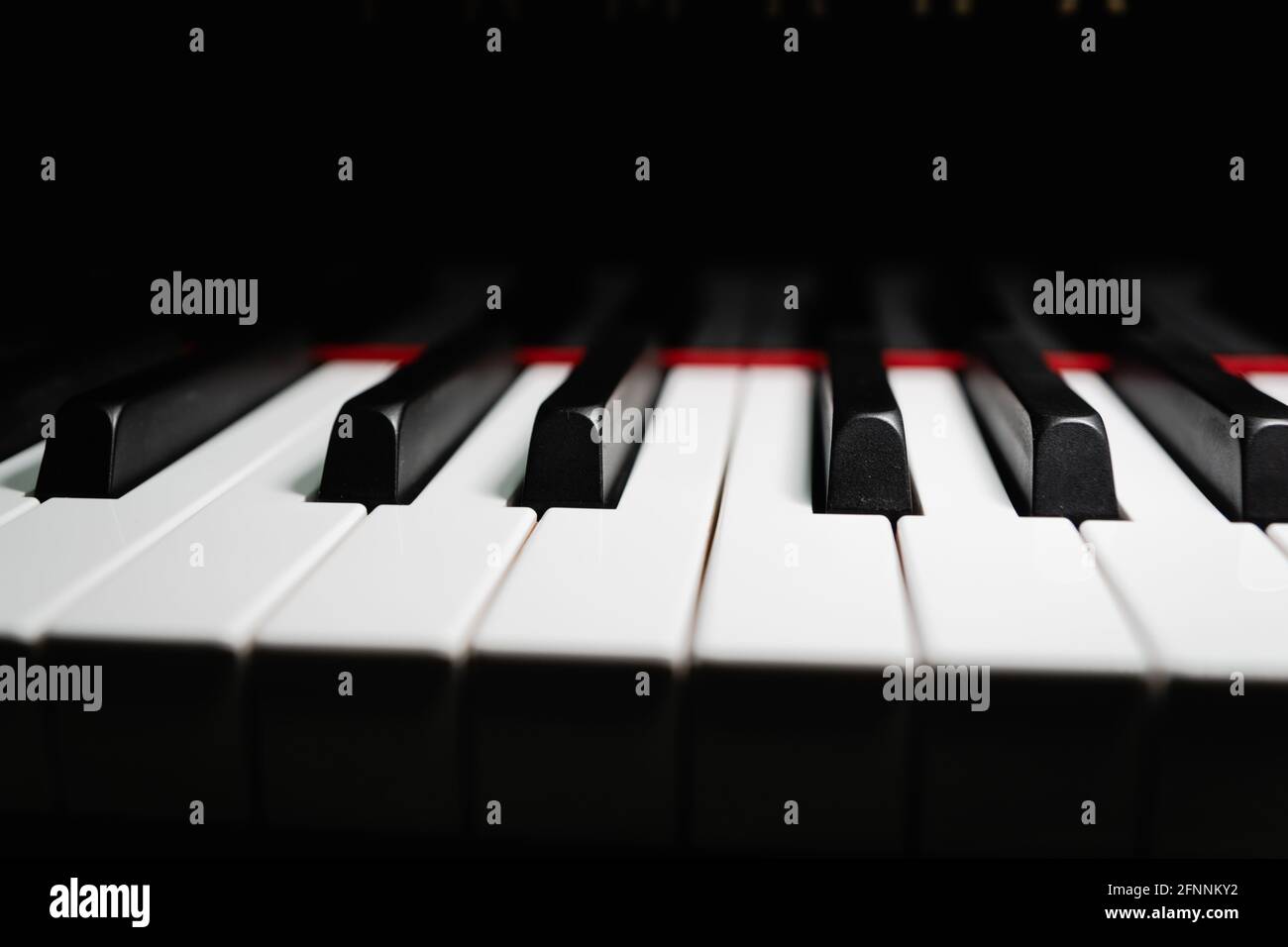 Piano keys on classical grand piano - closeup of piano keyboard for ...