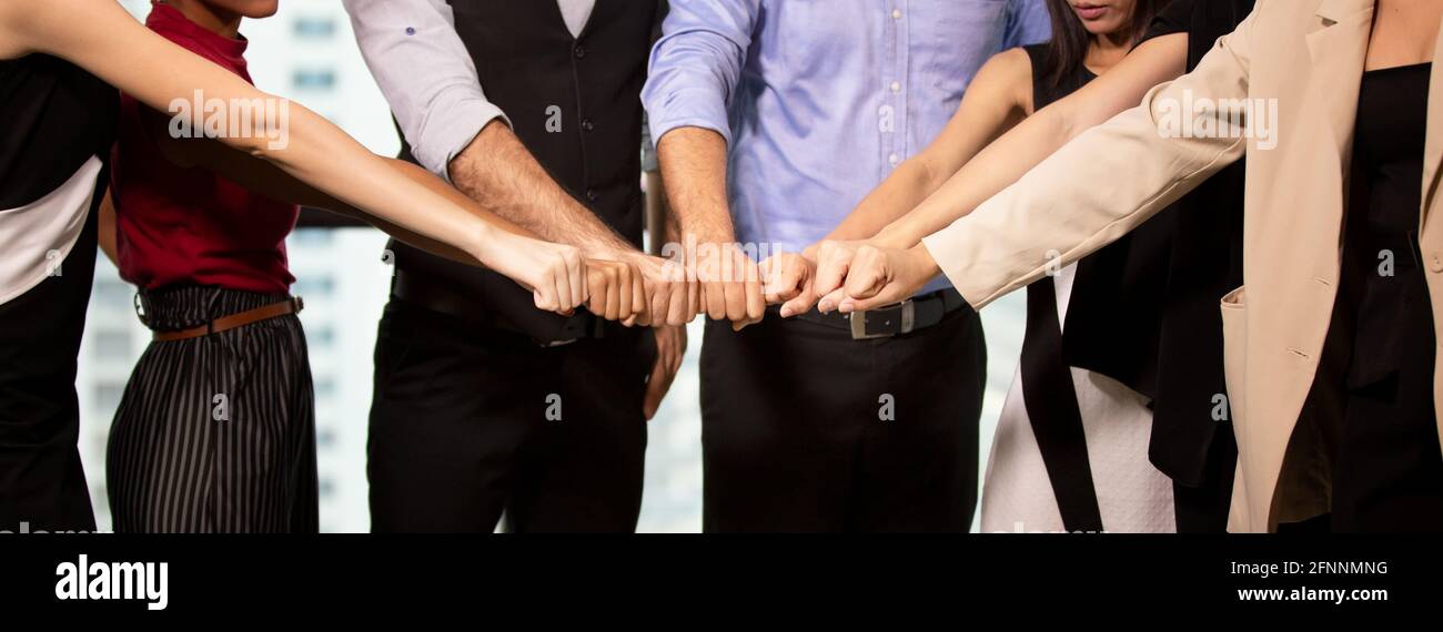 Close up on hands of business people join together on unity concept ...
