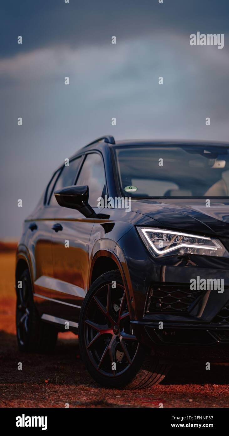 Black luxury expensive car on the side of the road outdoors Stock Photo ...