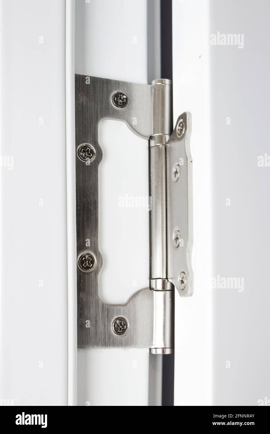 Stainless door hinges on a white door. Hinges on the white door Stock ...