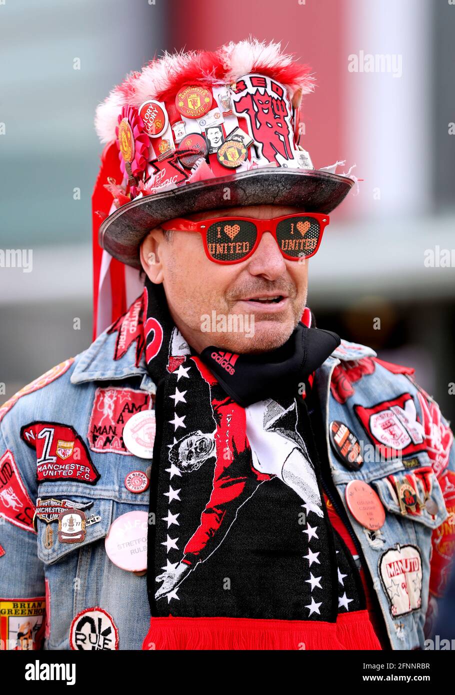 A Manchester United fan arrives at the stadium before the Premier ...