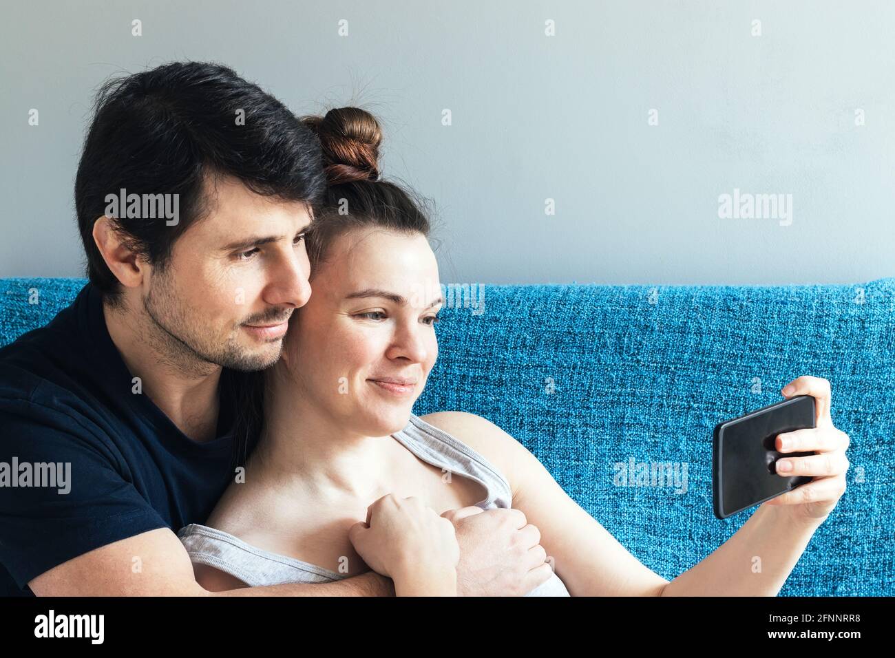 Mobile hugging hi-res stock photography and images - Alamy