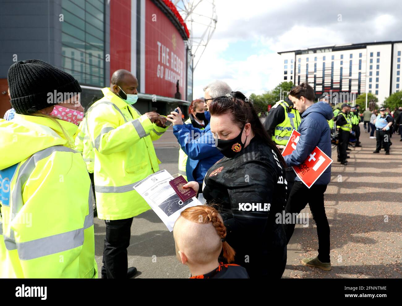 Manchester United fans go through security checks as they arrive at the ...