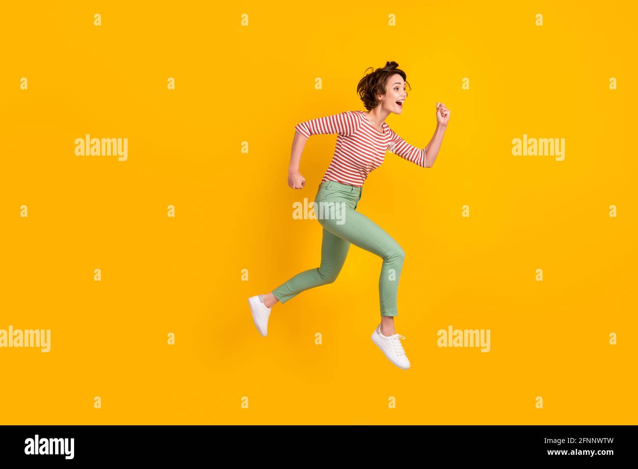 Full size profile photo of pretty lady rushing empty space hands fists ...