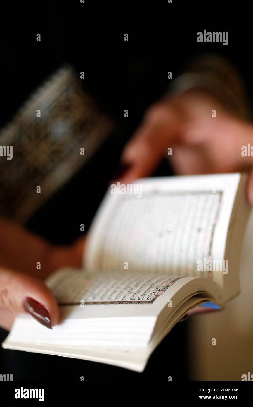 Muslim woman reading the noble Quran. United Arab Emirates Stock Photo ...