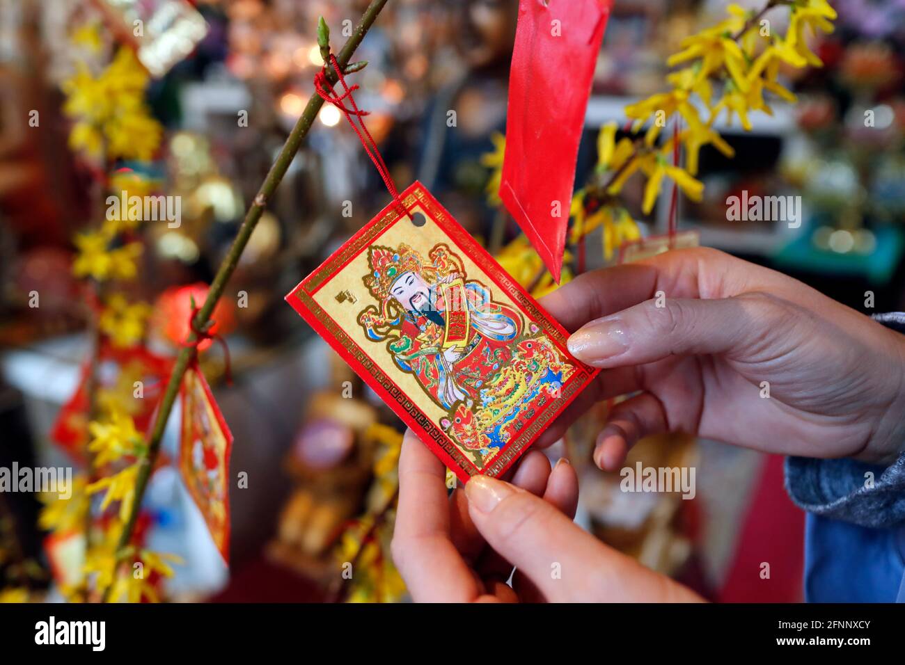 Tu An pagoda. Buddhist woman with red envelopes ( hongbao ) on yellow ...