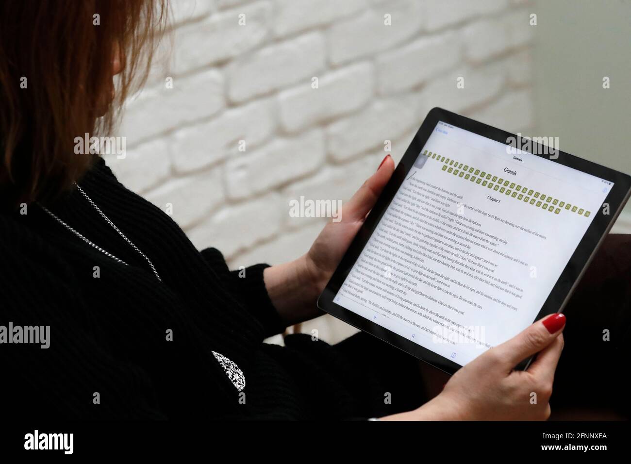Woman reading the bible on a digital tablet Ipad. France Stock Photo ...