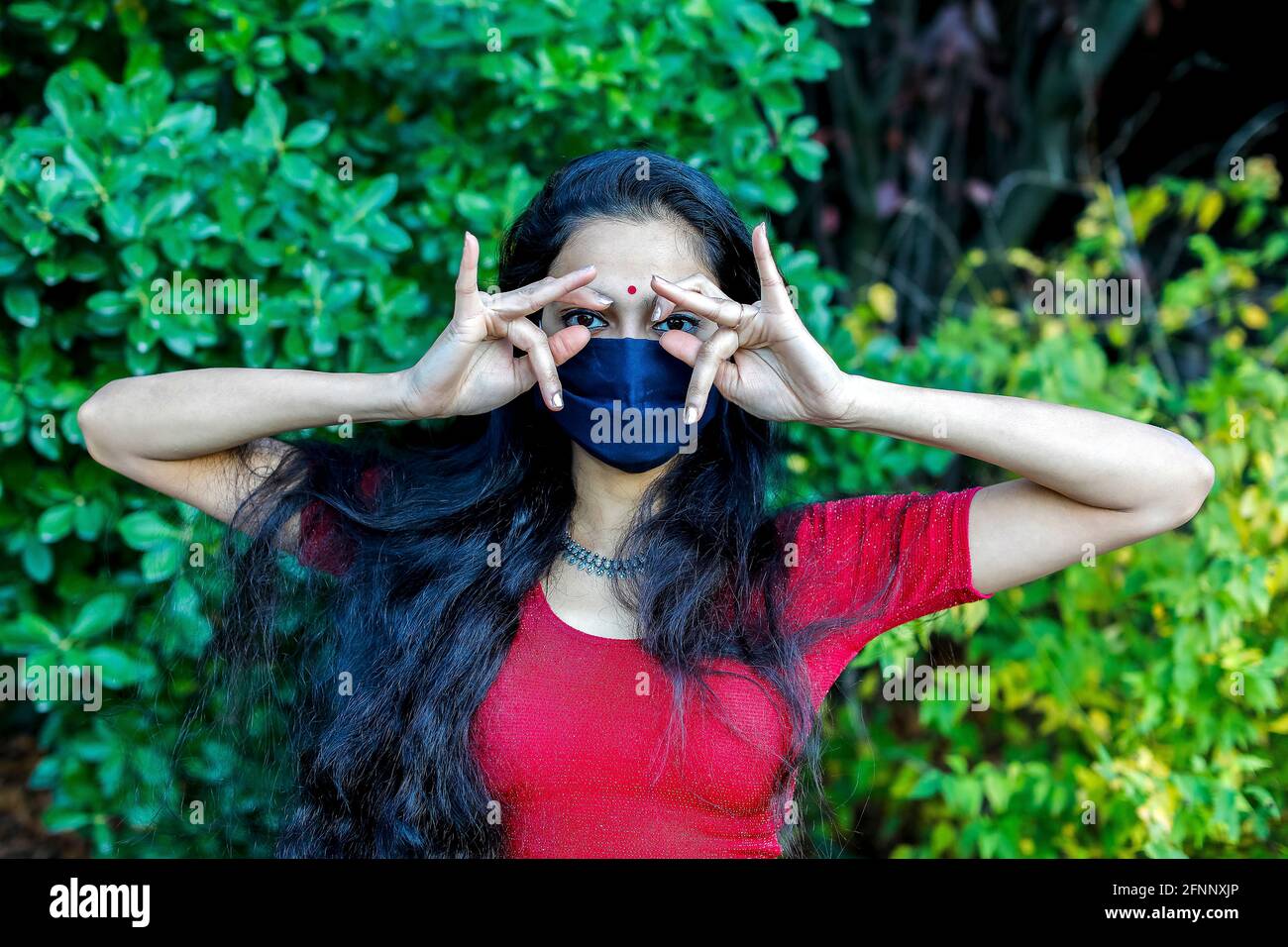 Indian woman wearing a mask hi-res stock photography and images - Alamy