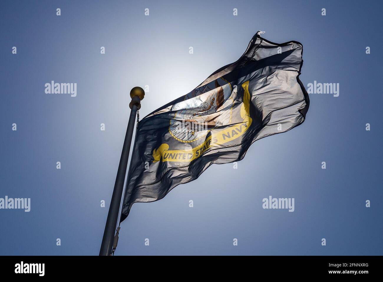 United States Navy Flag with blue sky and sunlight Stock Photo - Alamy