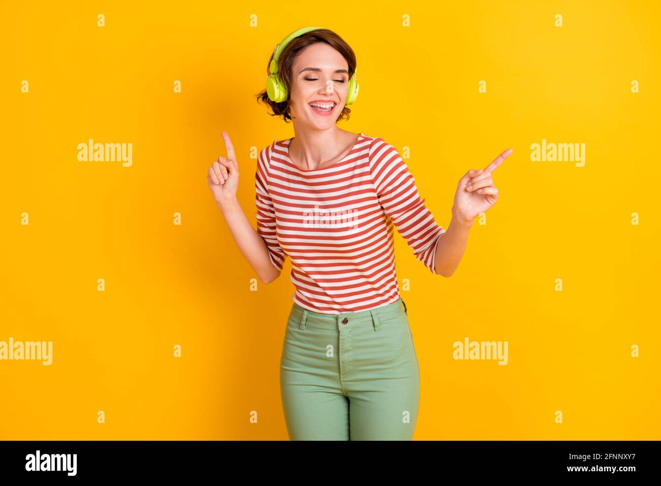 Photo of nice music lover dance finger entertain motion closed eyes ...