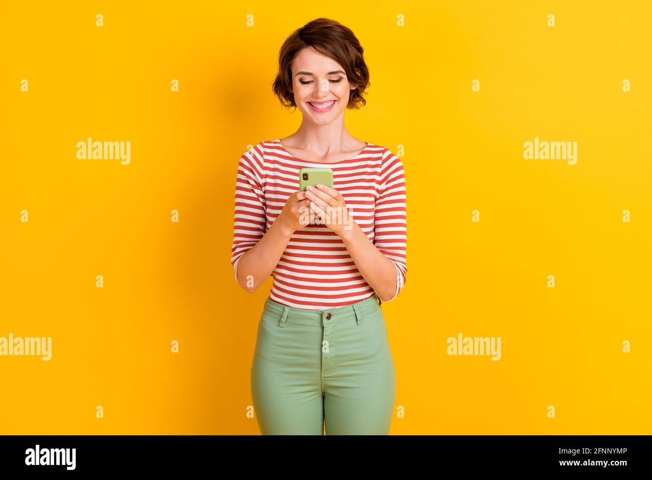 Portrait of charming pretty blogger influencer write post has good mood ...