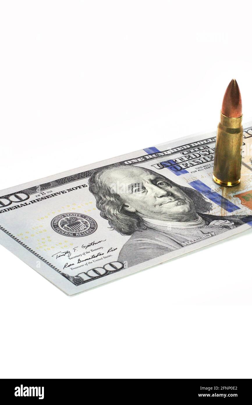 Bullet on dollar bill. Money on a white background. Bullet on a white ...