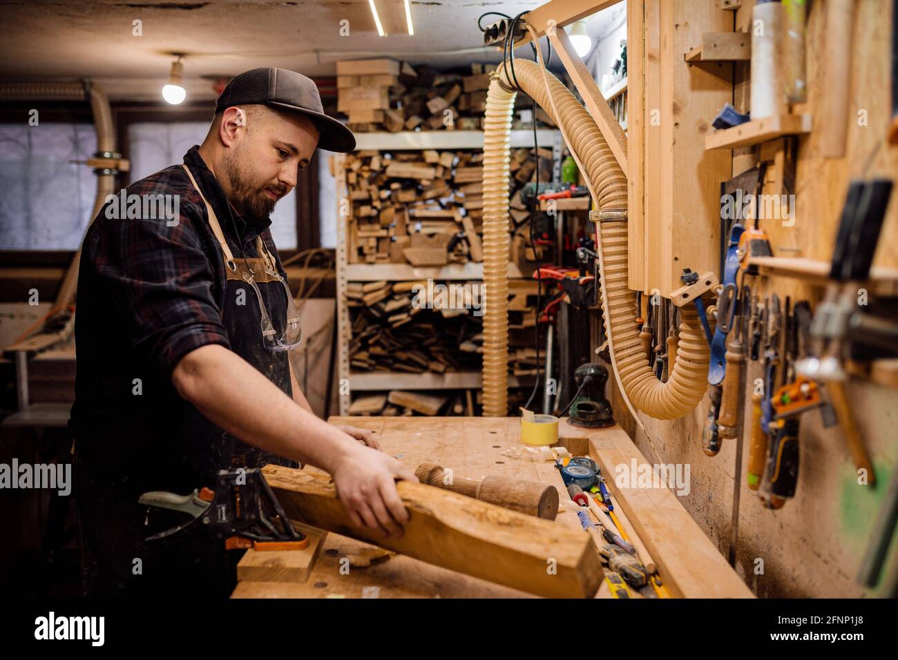 carpenter working with wood in the workshop Stock Photo - Alamy
