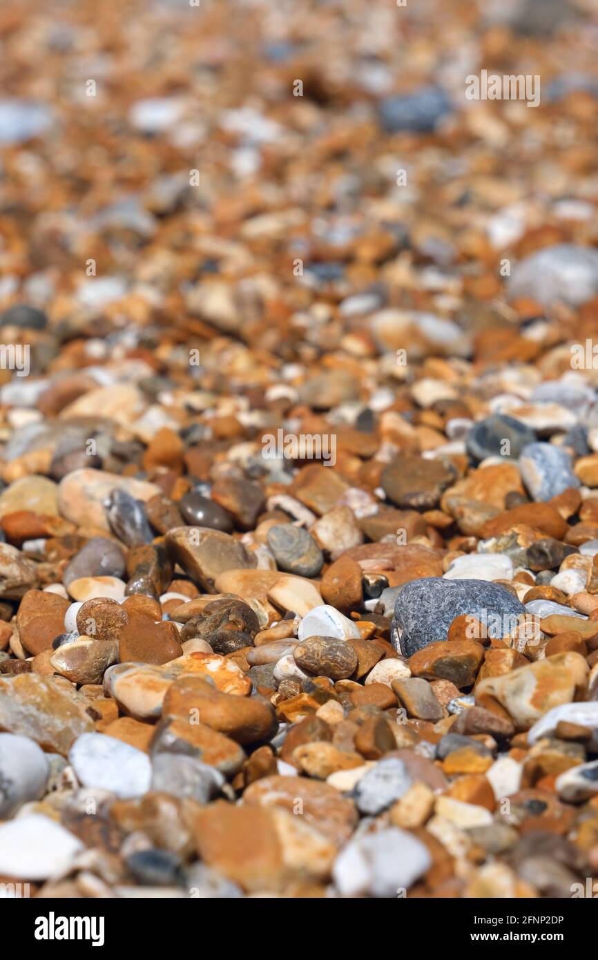 Vertical pebbles close-up, selective focus. Abstract blurred texture ...