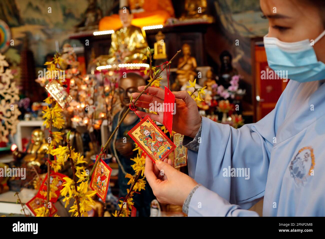 Tu An pagoda. Buddhist woman with red envelopes ( hongbao ) on yellow ...
