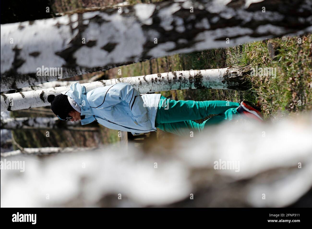 Woman resting against a tree after walking. Passy. France Stock Photo ...