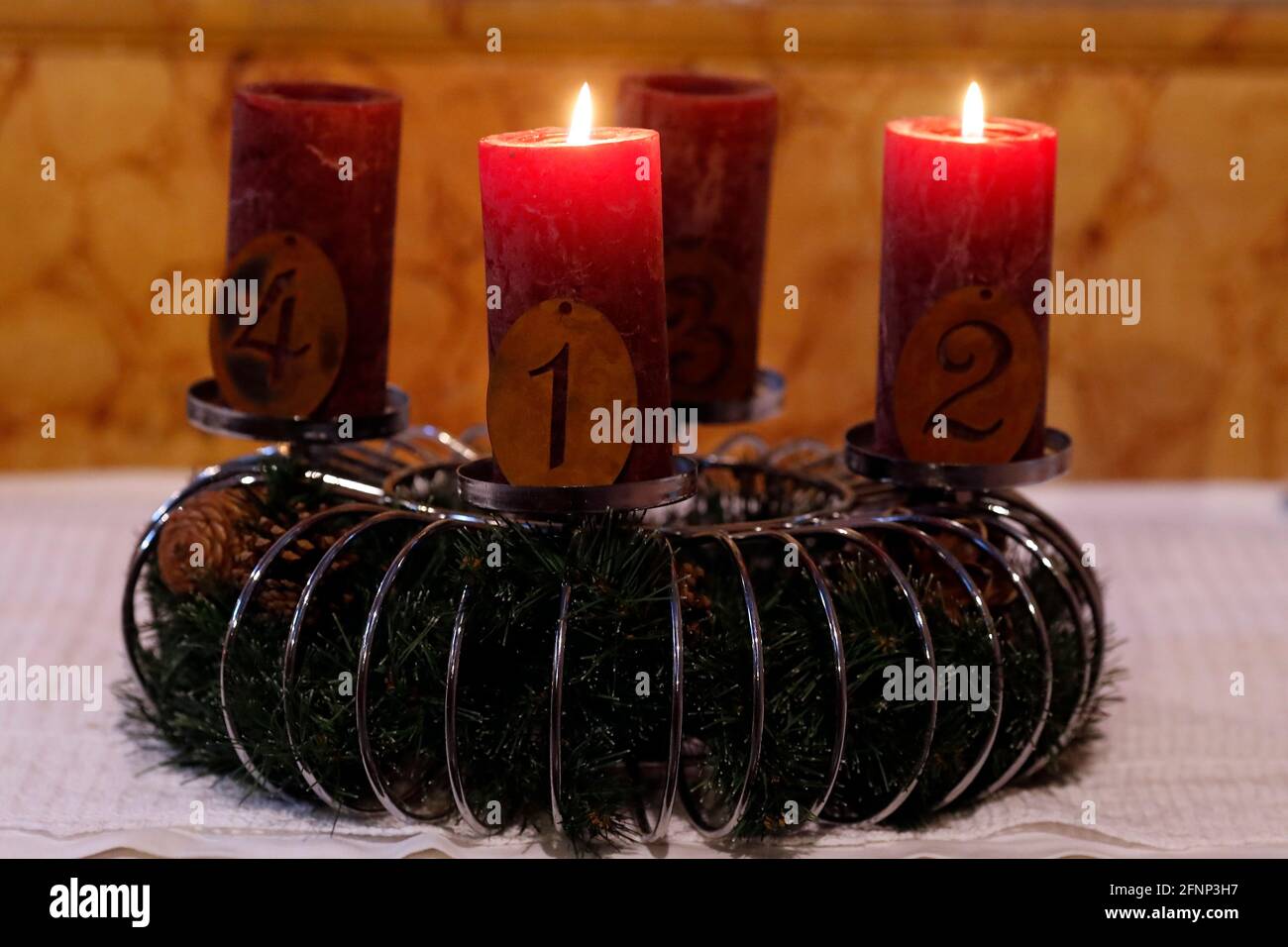 Natural advent wreath or crown in a catholic church with two burning ...