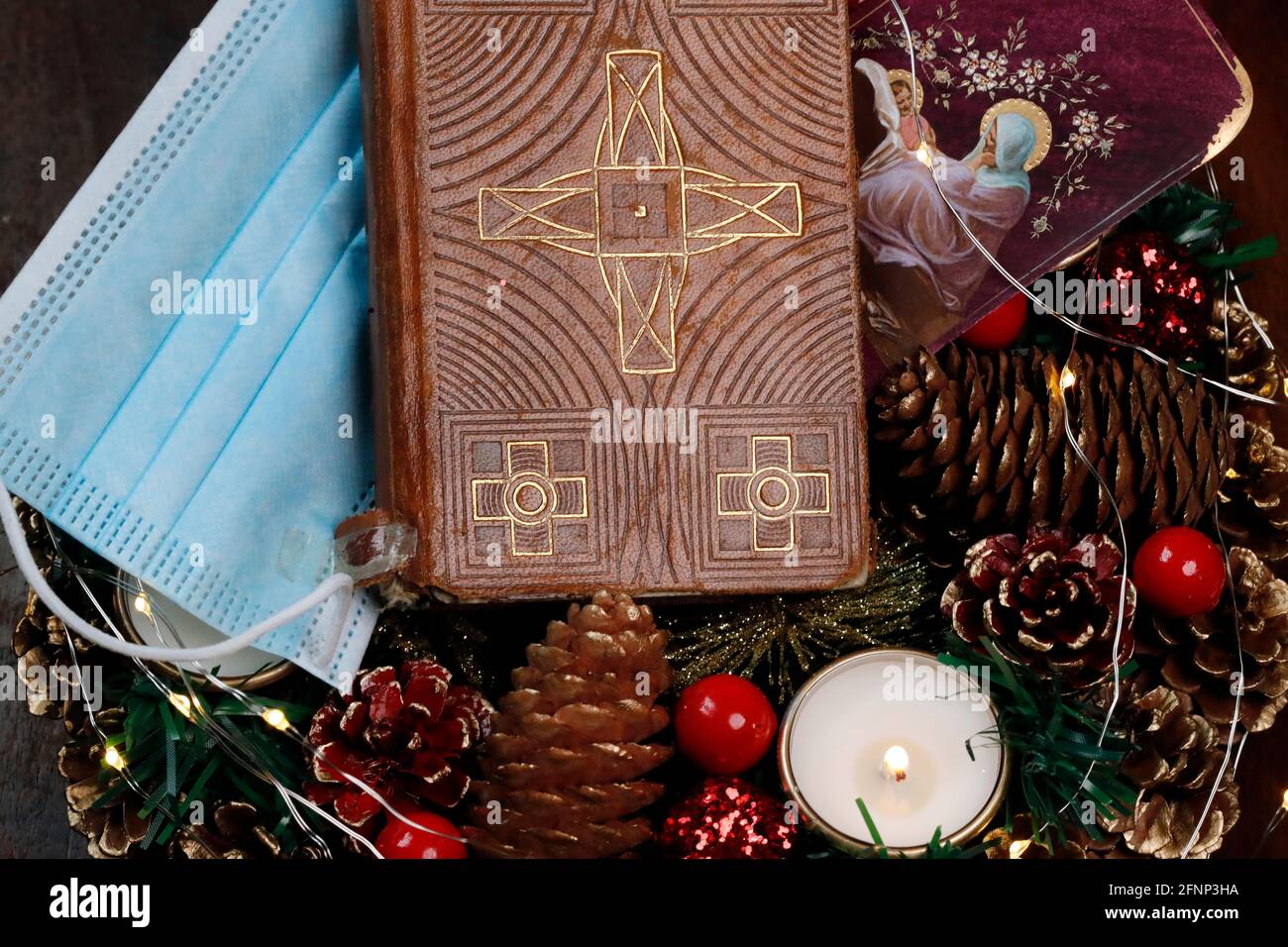 Advent wreath, bible and surgical mask. Christmas composition. France ...
