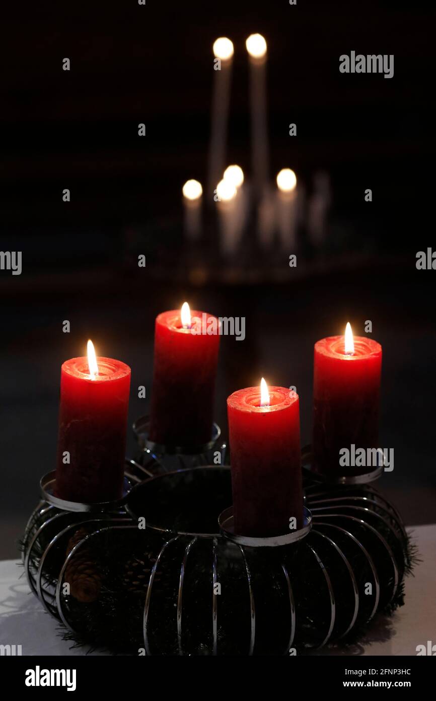 Natural advent wreath or crown in a catholic church with Four burning ...