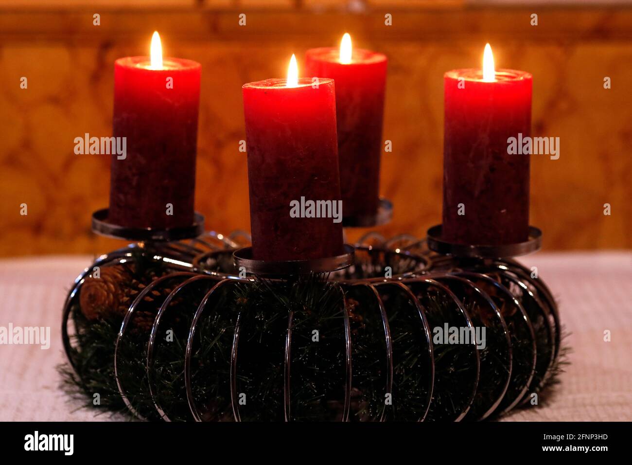 Natural advent wreath or crown in a catholic church with Four burning ...