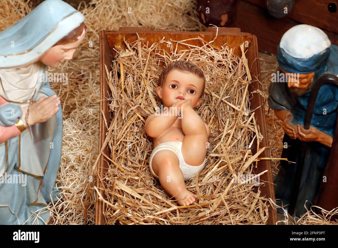 Nativity scene. Christmas crib. Holy family with baby Jesus. Catholic church. France Stock Photo ...