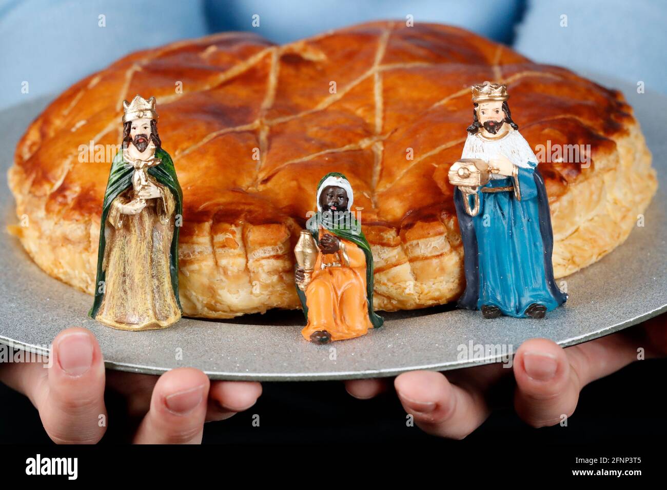 King cake, galette des rois. Three wise men figurines. A popular food ...