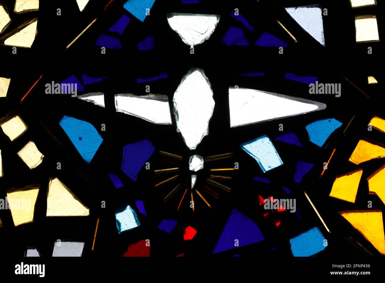 Saint Felix church. Stained glass. Dove of holy Spirit. Symbol of ...