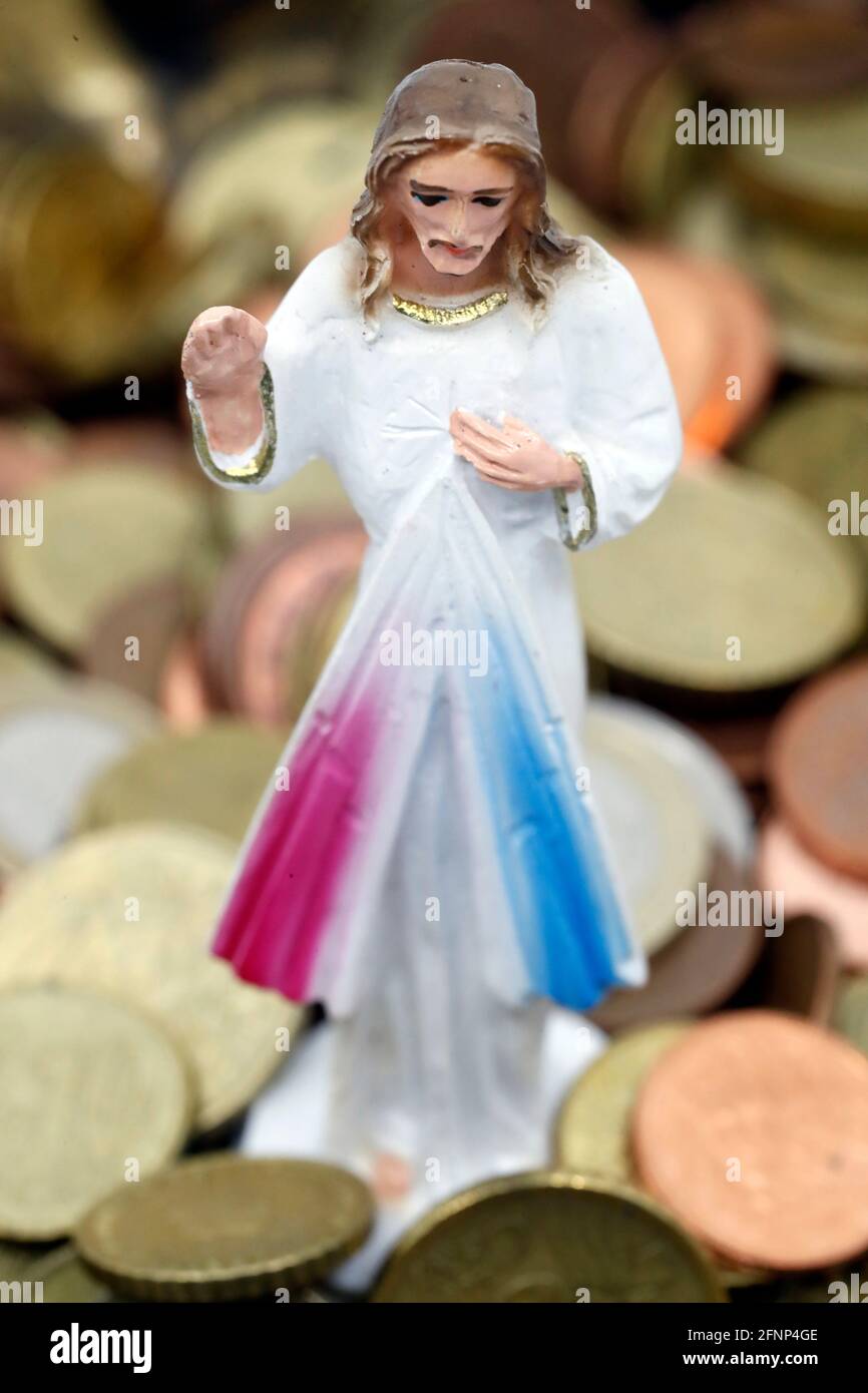 Catholic finance and economy concept. Jesus and euro coins. France ...