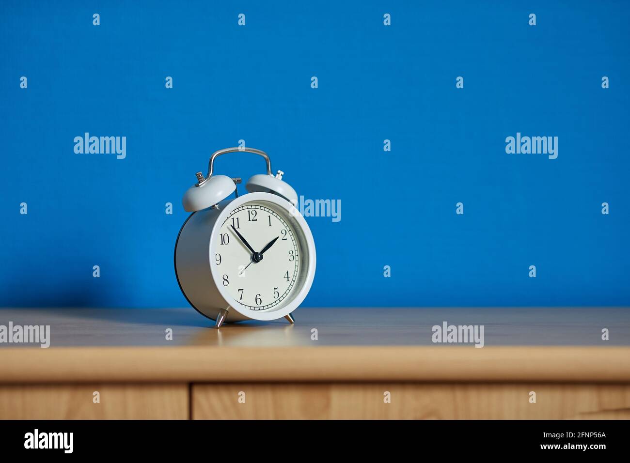 Alarm Clock on a Shelf Stock Photo - Alamy