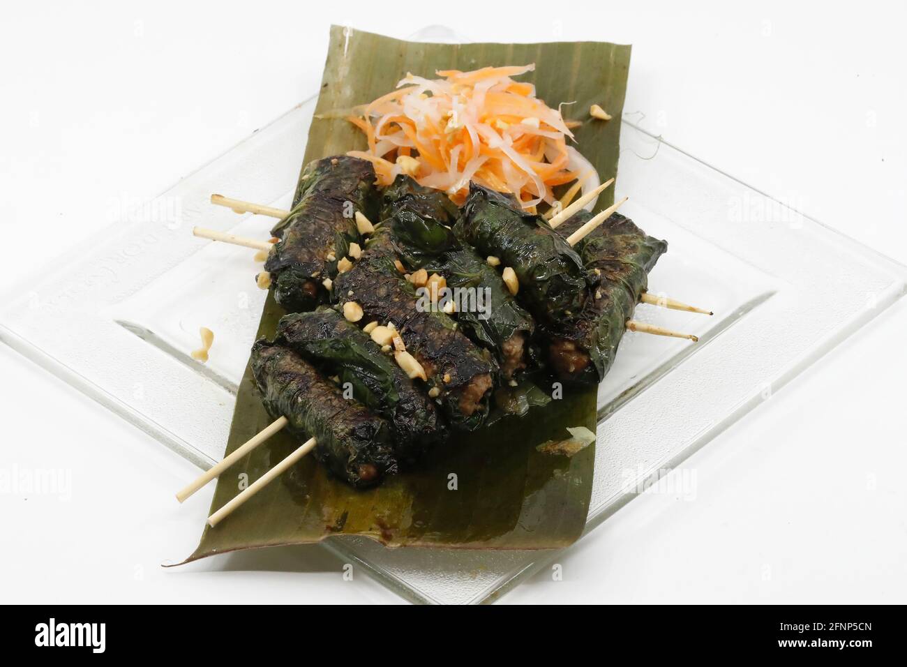 Vietnamese cuisine. Bo la lop, a grilled beef roll. France Stock Photo ...
