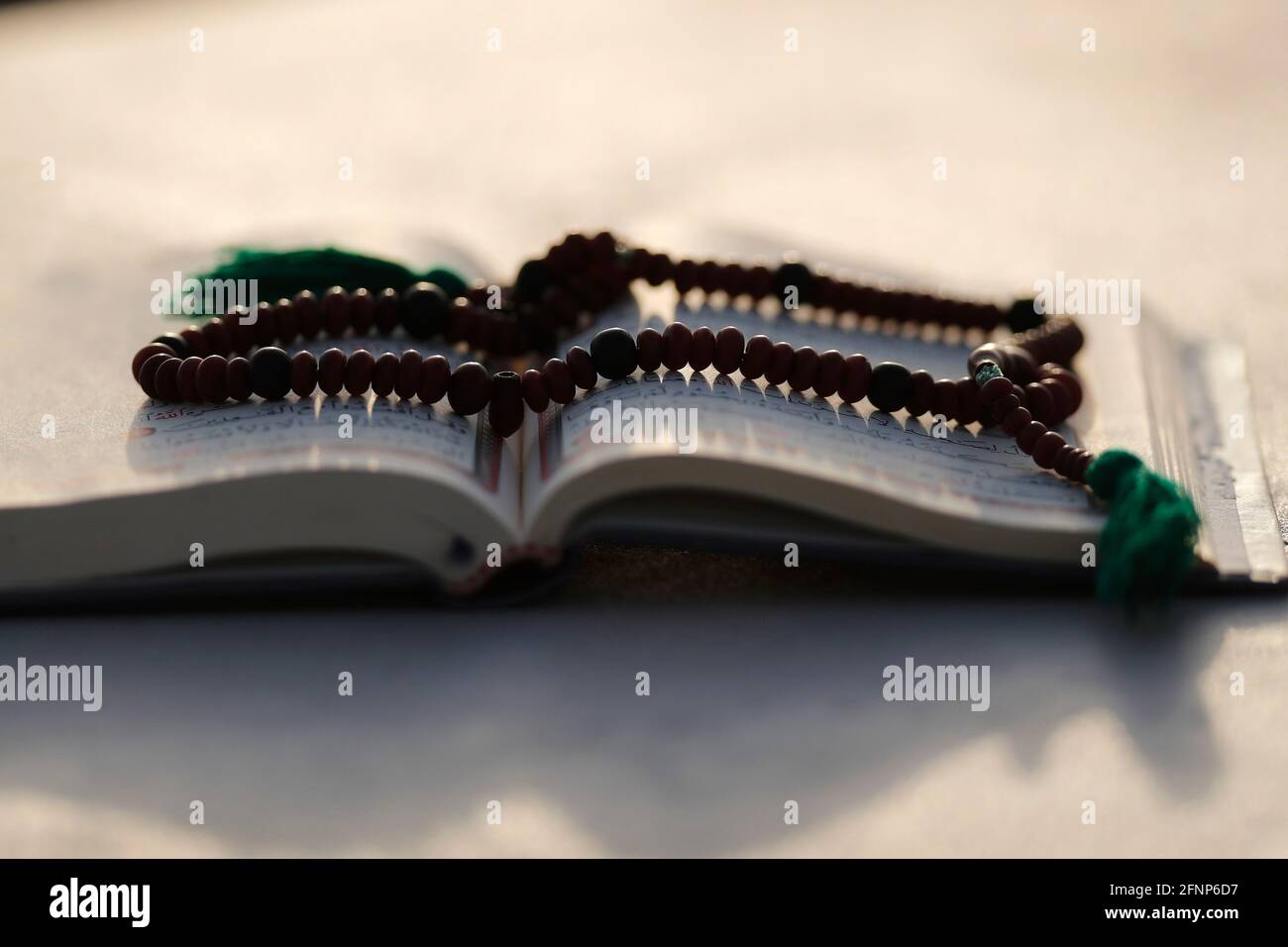 Quran and prayer beads ( misbaha ) . Symbols of Islam. United Arab ...