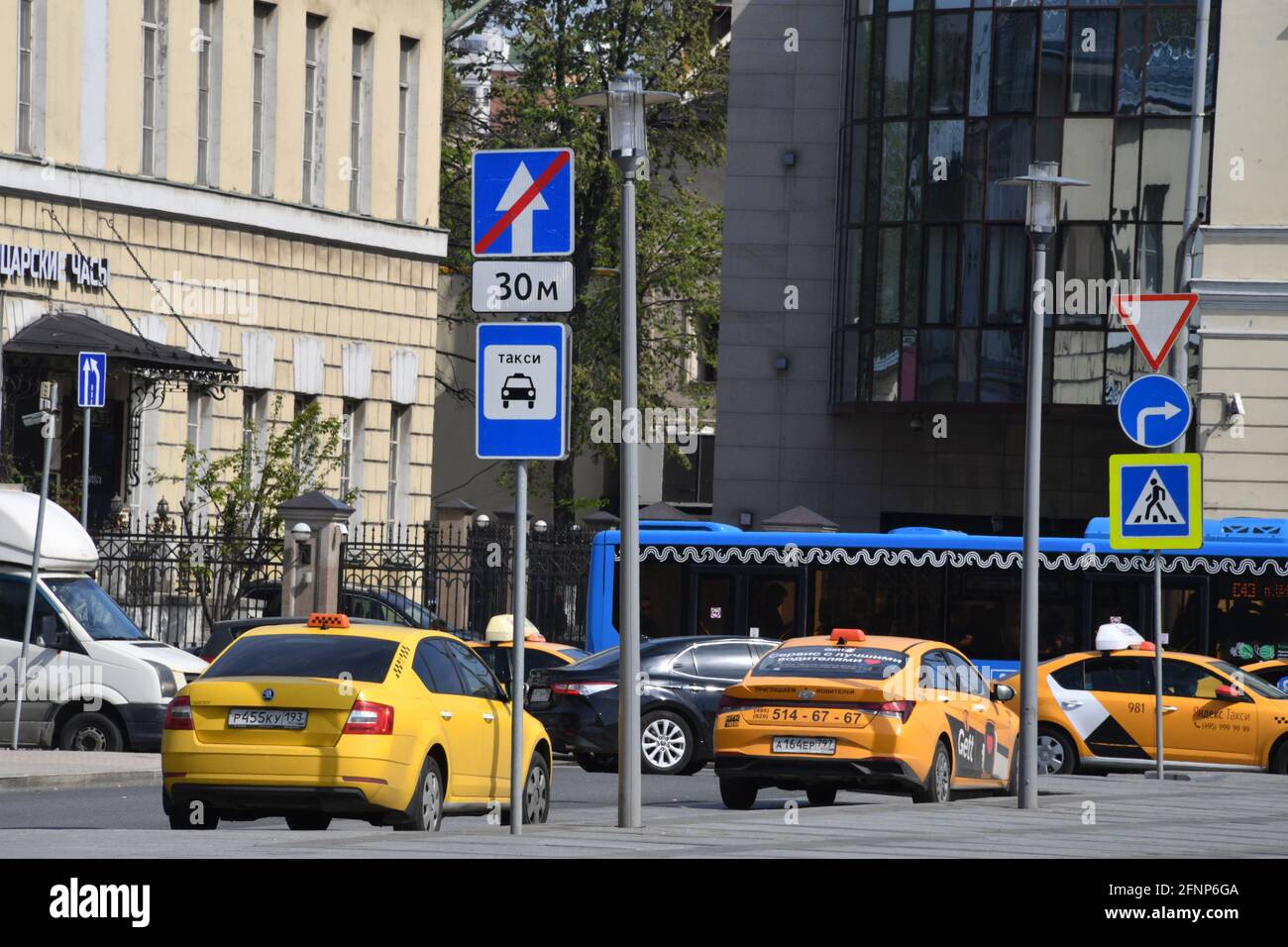 Moscow. Taxi cars on one of the city streets Stock Photo - Alamy