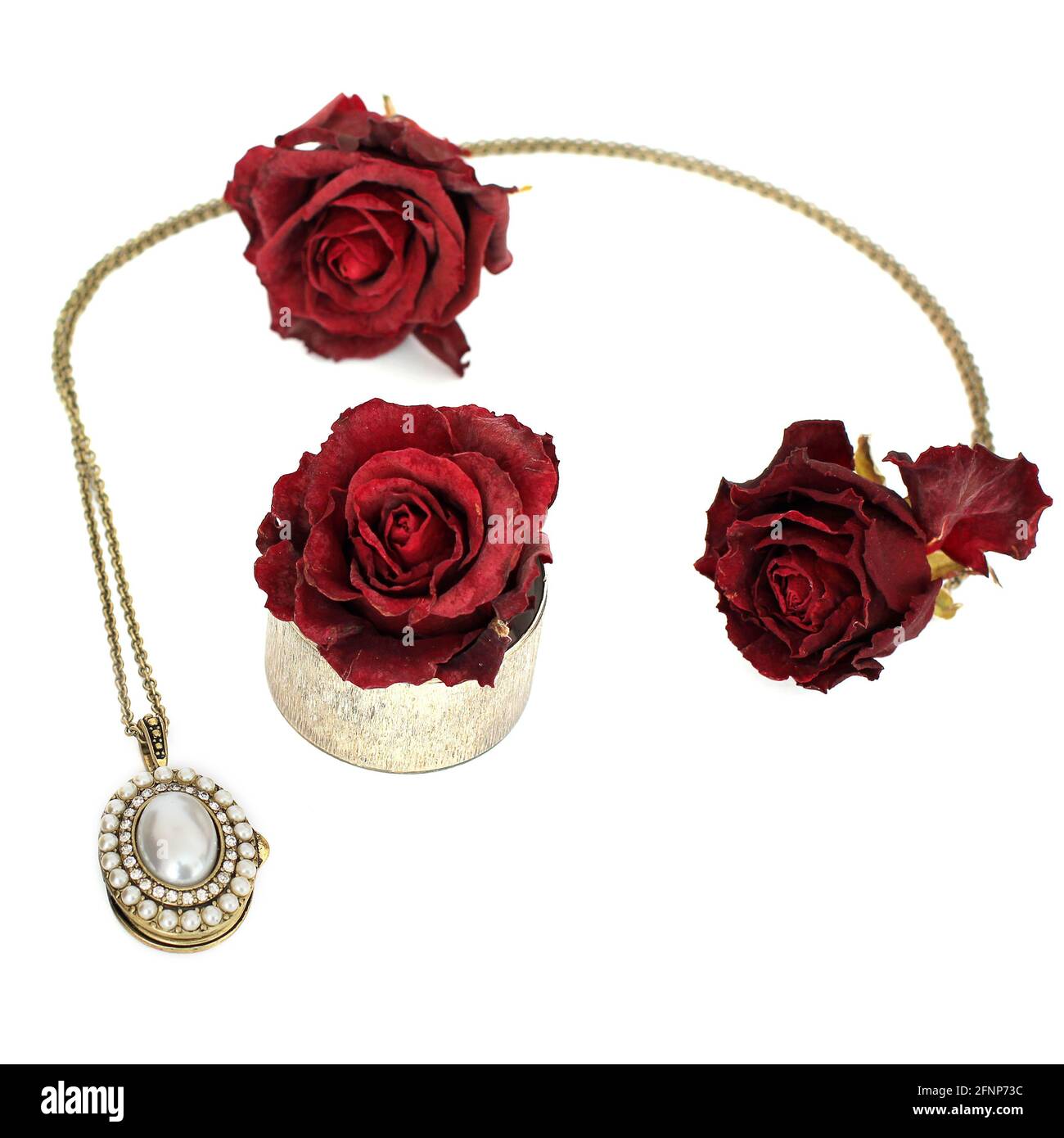 Jewelry and flowers. Necklace and red roses Stock Photo - Alamy