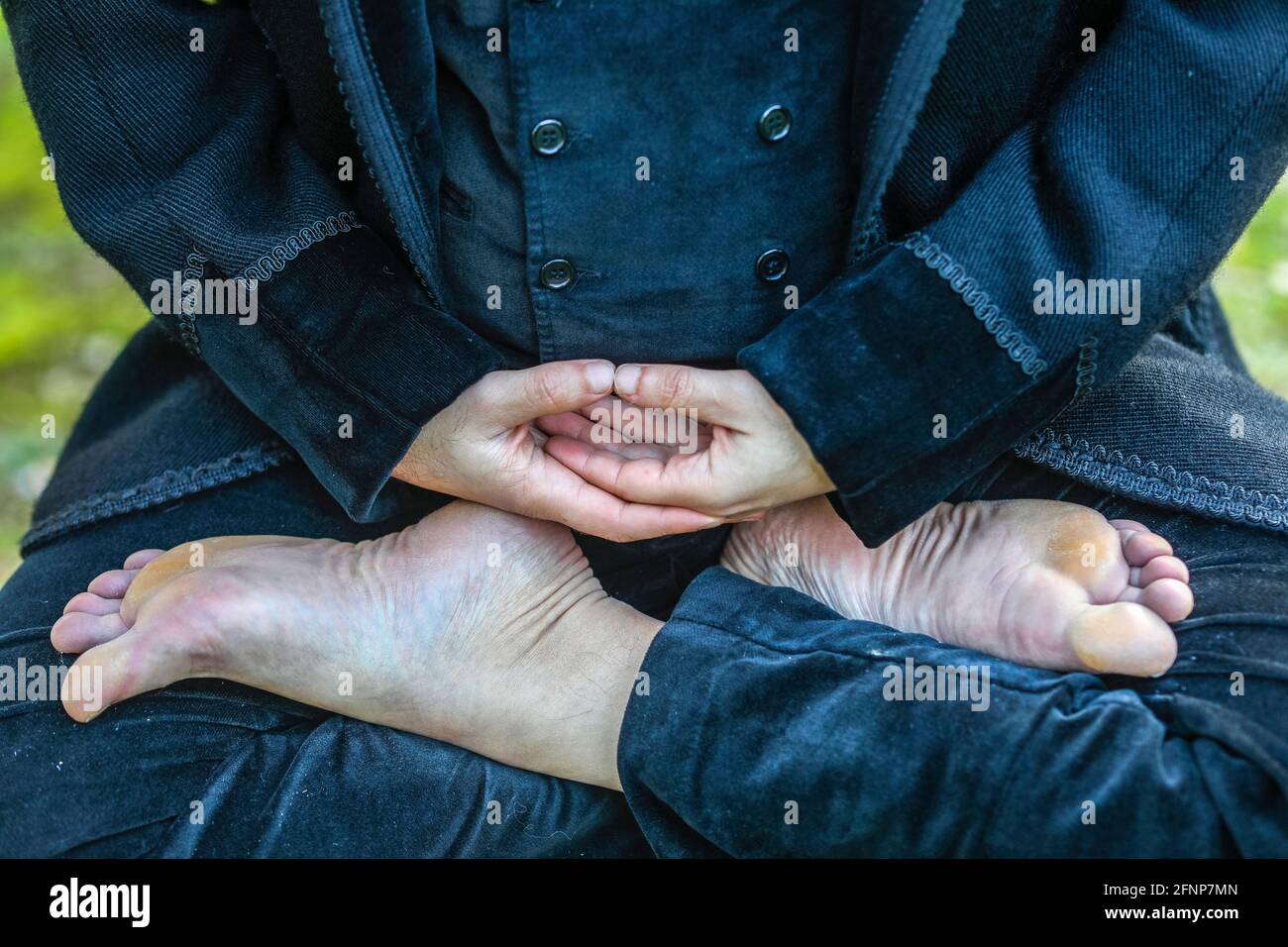 Sardinian man sitting and meditating in Biru 'E Concas megalitic ...