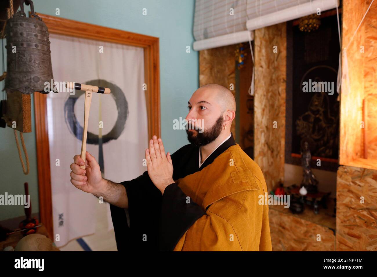 Zen buddhist master calling disciples to zazen in his dojo in Marrubiu ...