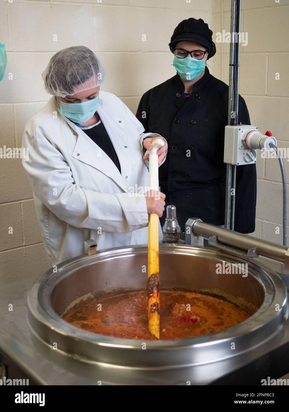 women food production workers in the factory Stock Photo - Alamy