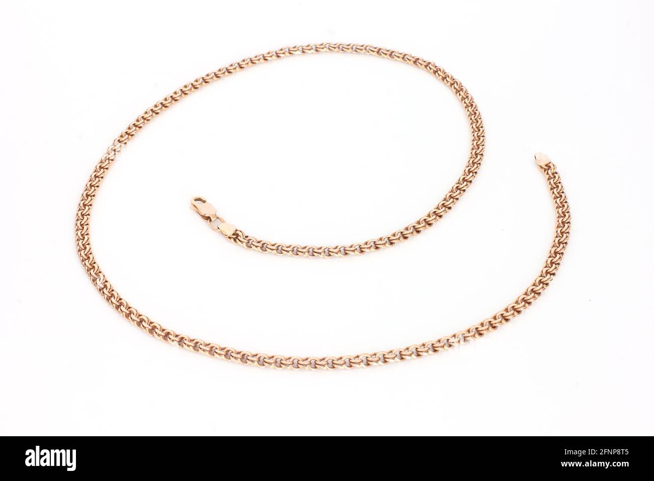 Gold chain on a white background. Gold Stock Photo - Alamy