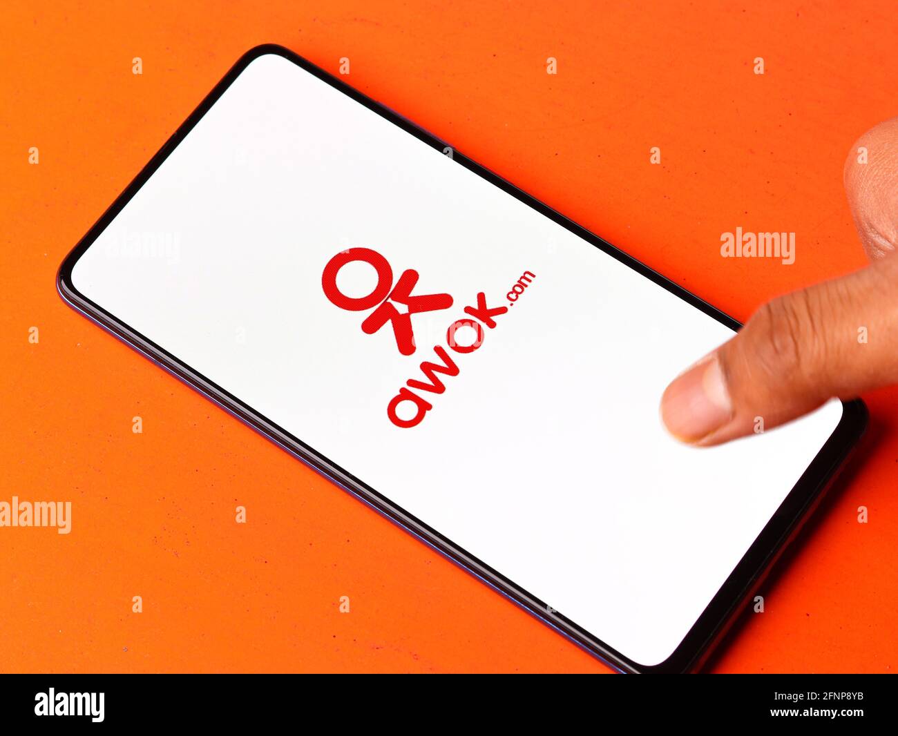 Assam, india - May 18, 2021 : Awok logo on phone screen stock image ...